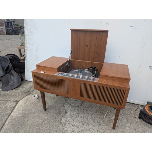 A retro HMV amplified record player with a Garrard 3000 turntable