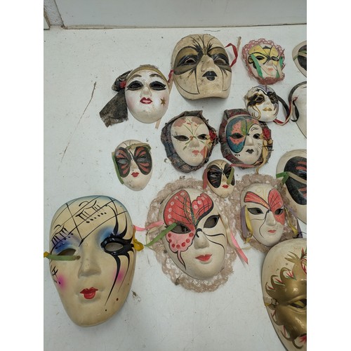 A quantity of vintage ceramic masquerade masks