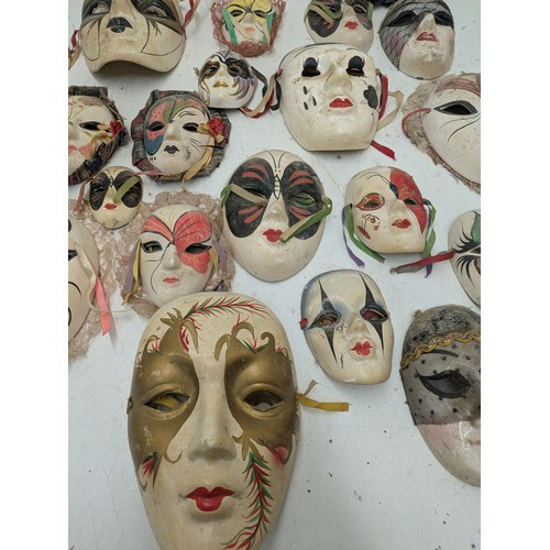 A quantity of vintage ceramic masquerade masks
