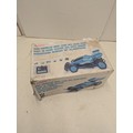 A retro Tandy Green Lizard RC buggy in original box