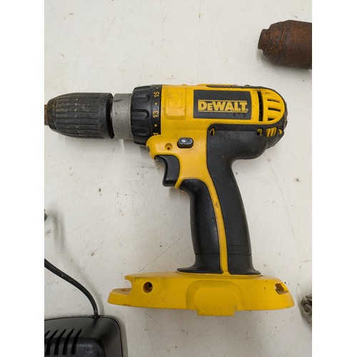 A trio of DeWalt cordless power tools and charger