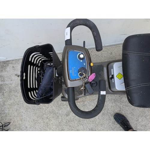 A mobility scooter with key and charger - powers on