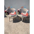 A pair of unique retro bucket chairs