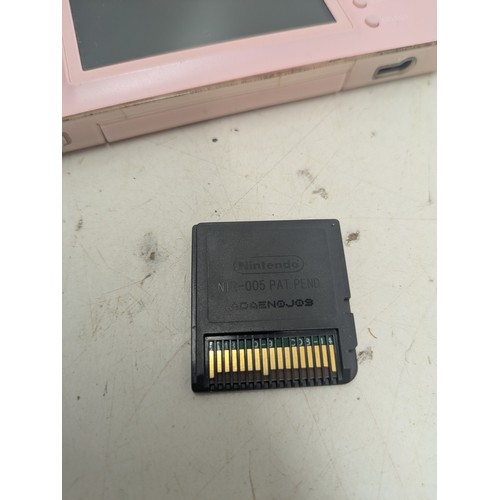 A pink Nintendo ds lite console - with Pokémon diamond game