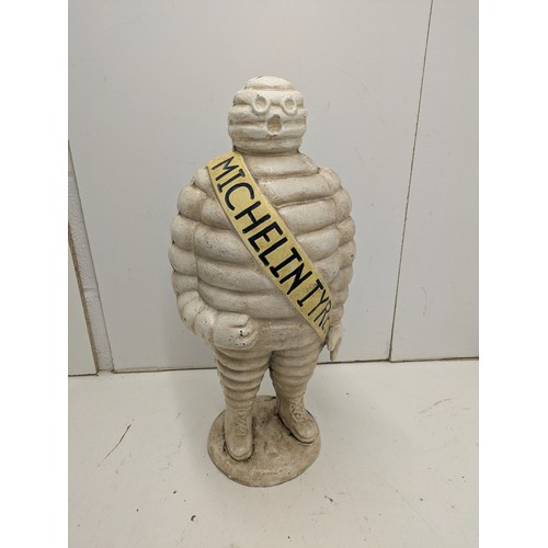 A large vintage cast iron Michelin man figure
