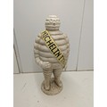 A large vintage cast iron Michelin man figure