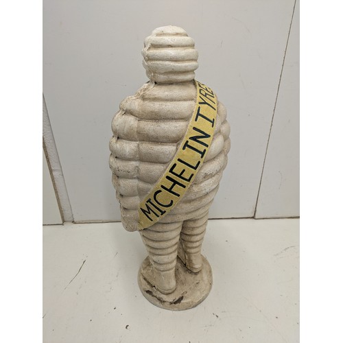A large vintage cast iron Michelin man figure