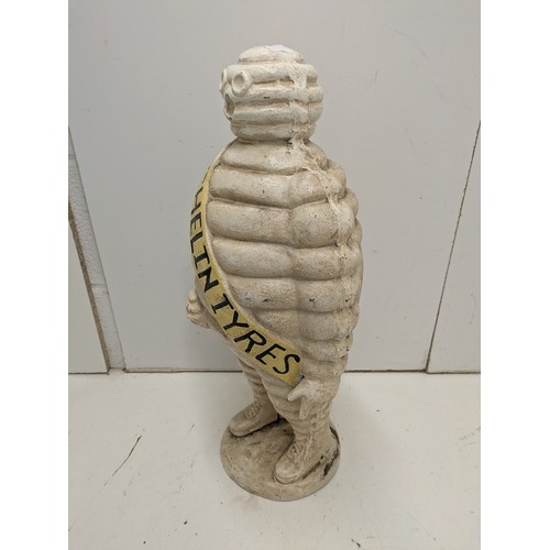 A large vintage cast iron Michelin man figure