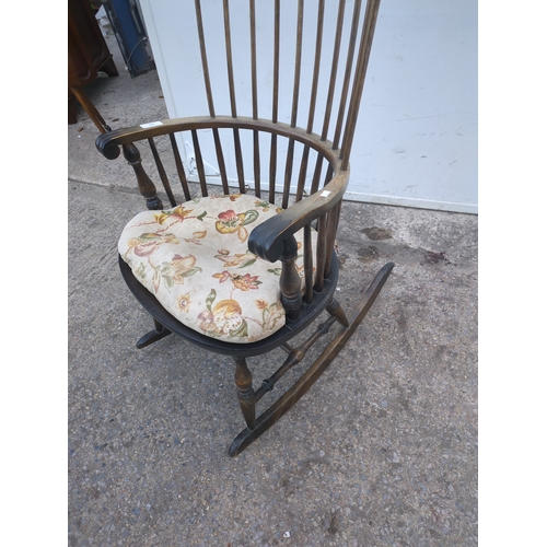 An antique oak spoked back captains rocking chair