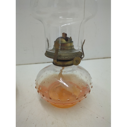 A pair of vintage paraffin lamps