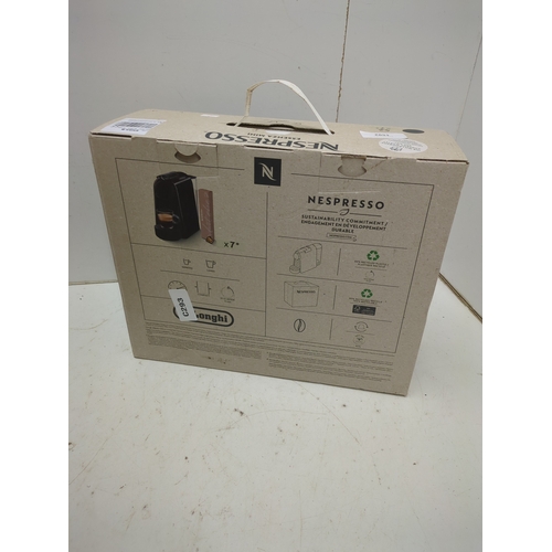 A Nespresso Essence mini coffee machine in box