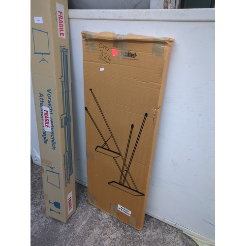 A Reflecta projector screen in box