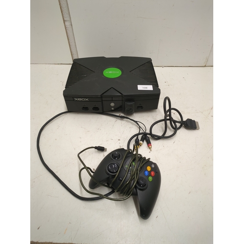 An xbox original console with controller