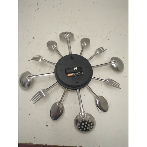 A kitchen cutlery quartz wall clock