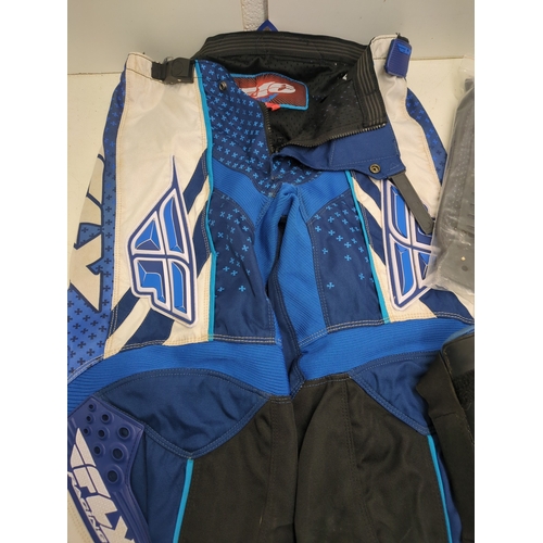 A complete Motocross body armor and protection including fly racing ...