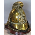 A Victorian Merryweather fireman's helmet in brass with ornate comb ...
