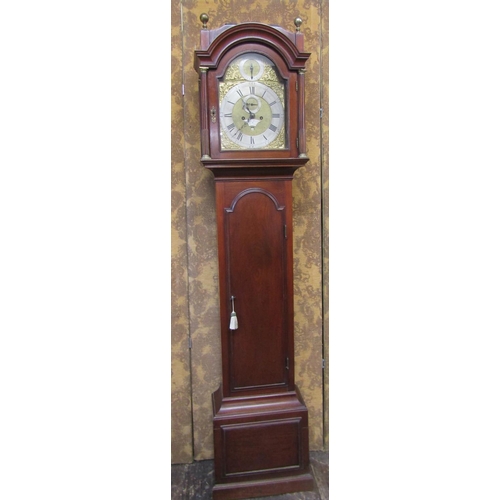 A Georgian mahogany London longcase clock with arched door the hood ...