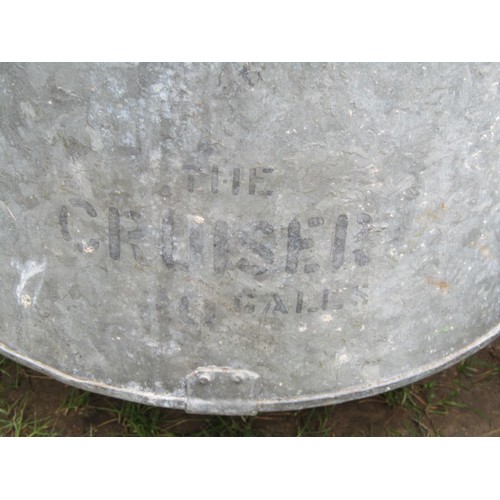 A vintage two wheeled water barrow, the iron frame supporting a ...