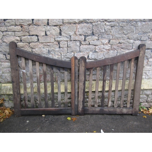 Pair of simple weathered oak entrance gates with open vertical slats ...