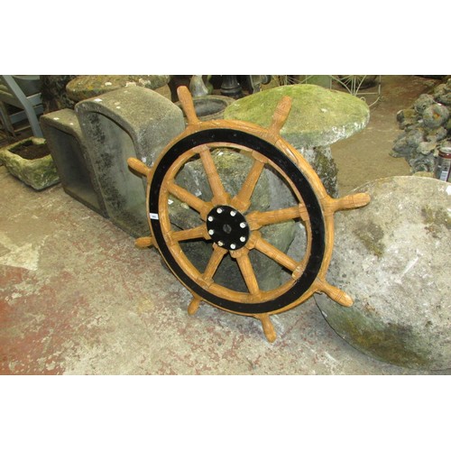 A vintage weathered wooden ship’s wheel with iron fittings 92cm diameter
