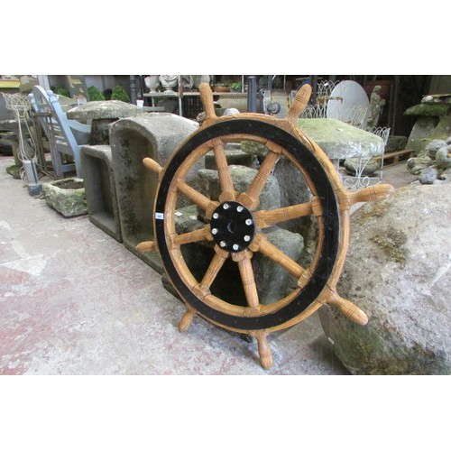 A vintage weathered wooden ship’s wheel with iron fittings 92cm diameter