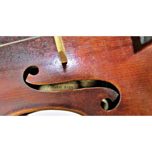 An old violin with a label to the interior Antonius Stradivarius ...
