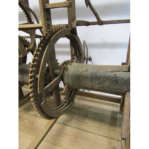 A large iron tower clock movement, believed to be late 17th century, in ...