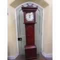 A 19th century cottage longcase clock with mahogany grained finish, the ...