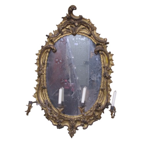 An 18th century girandole, the Rococo style frame with scrolled and ...