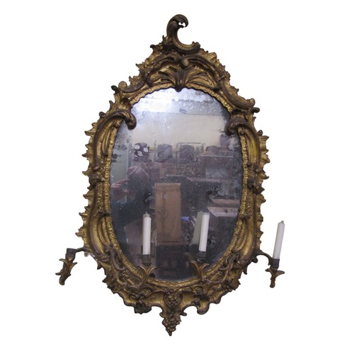 An 18th century girandole, the Rococo style frame with scrolled and ...