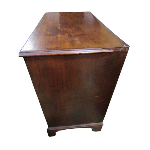 A Georgian mahogany chest of two short and three long drawers on ...