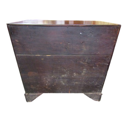 A Georgian mahogany chest of two short and three long drawers on ...