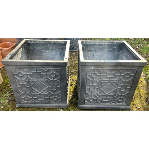 A pair of large square faux lead planters with repeating panels, 45cm ...