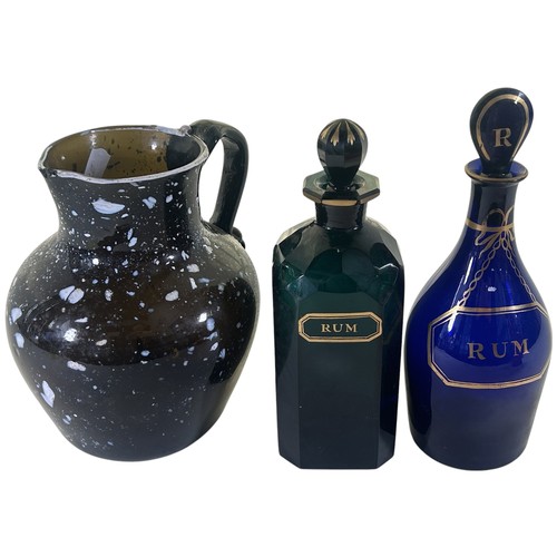A Bristol Blue Glass Rum decanter 23cm high, another green glass rum ...