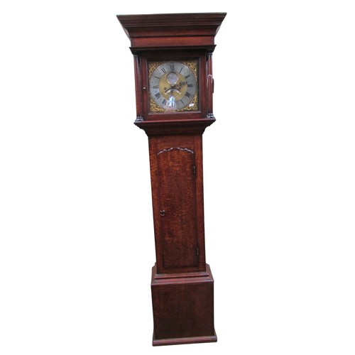 An 18th century oak longcase clock, enclosing a square brass dial with ...