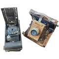 A Kodak No.1A Pocket bellows camera, and an early 20th century wooden ...