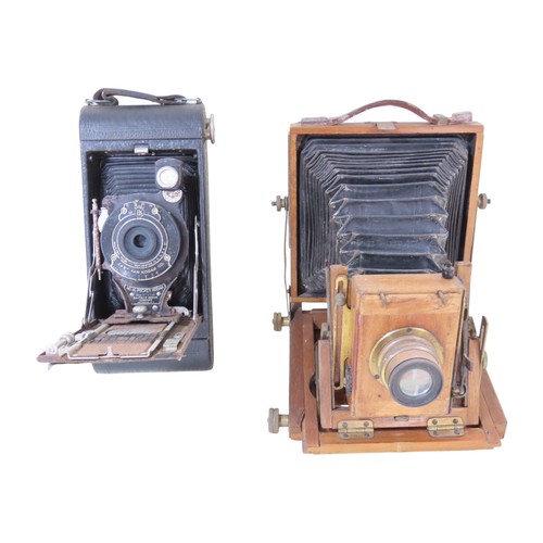 A Kodak No.1A Pocket bellows camera, and an early 20th century wooden ...