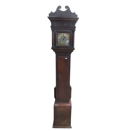 An unusually small 18th century oak longcase clock enclosing a 17cm ...