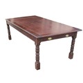 A large oak library table on turned supports with inset leather top ...