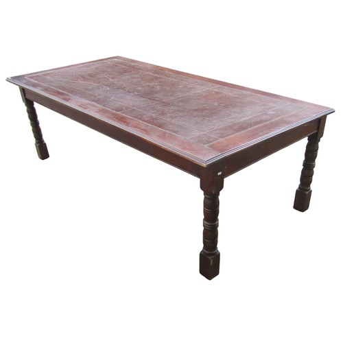 A large oak library table on turned supports with inset leather top ...