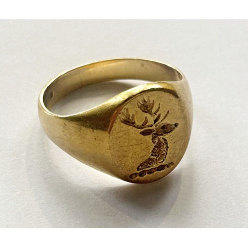 A 9ct yellow gold signet ring, engraved with a stag’s head device, size ...