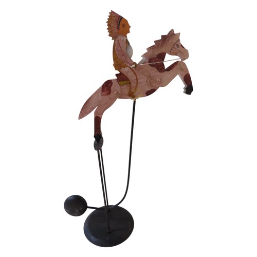 A pair of decorative painted folk art balancing toys / automata, on the ...