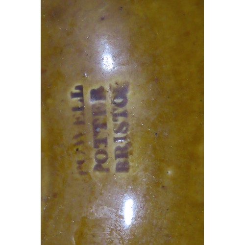 Four vintage stoneware flagons, one with impressed merchants mark for ...