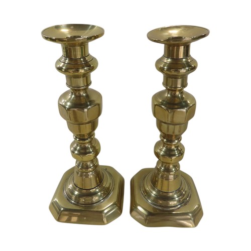 A pair of Georgian bell metal candlesticks, further Victorian brass ...