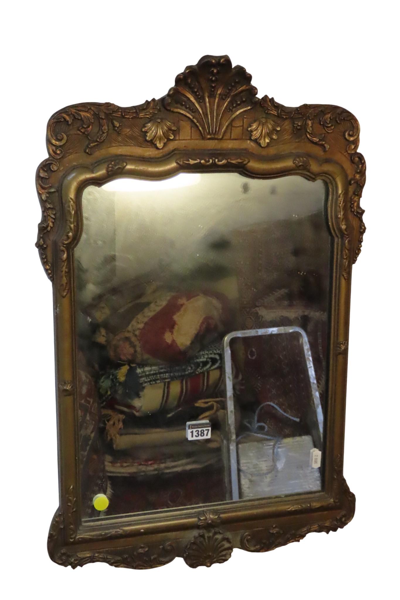 A Georgian style wall mirror the moulded gilt frame with scrolling ...