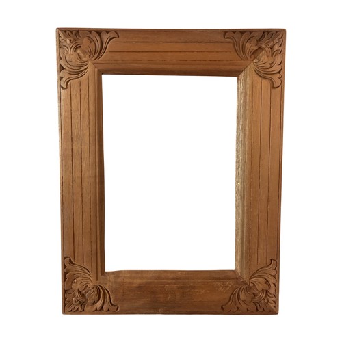 A collection of twenty-five carved wooden picture frames, of varying ...