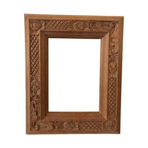 A collection of twenty-five carved wooden picture frames, of varying ...