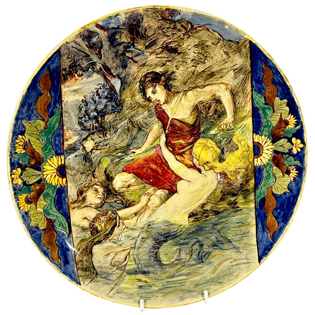 A late 19th century pottery wall plate with hand painted detail showing ...