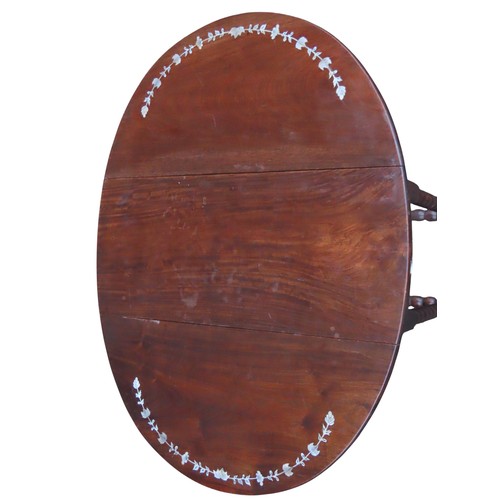 A small dense mahogany oval drop leaf gateleg occasional table, with ...