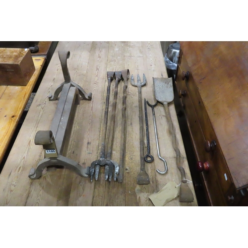 Five blacksmith made wrought iron fire irons together with a pair of ...